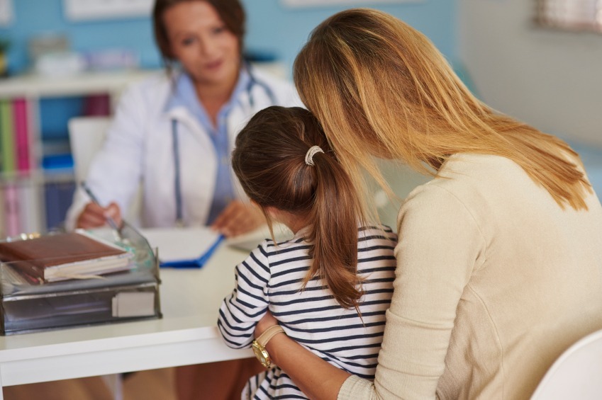 Child and parent visit primary care physician - The Oshman Firm
